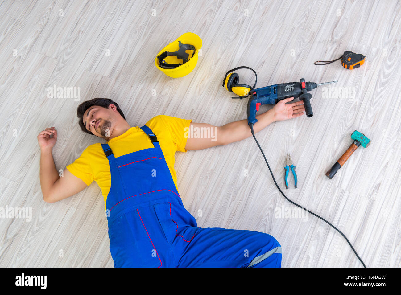 The injured worker at the work site Stock Photo - Alamy