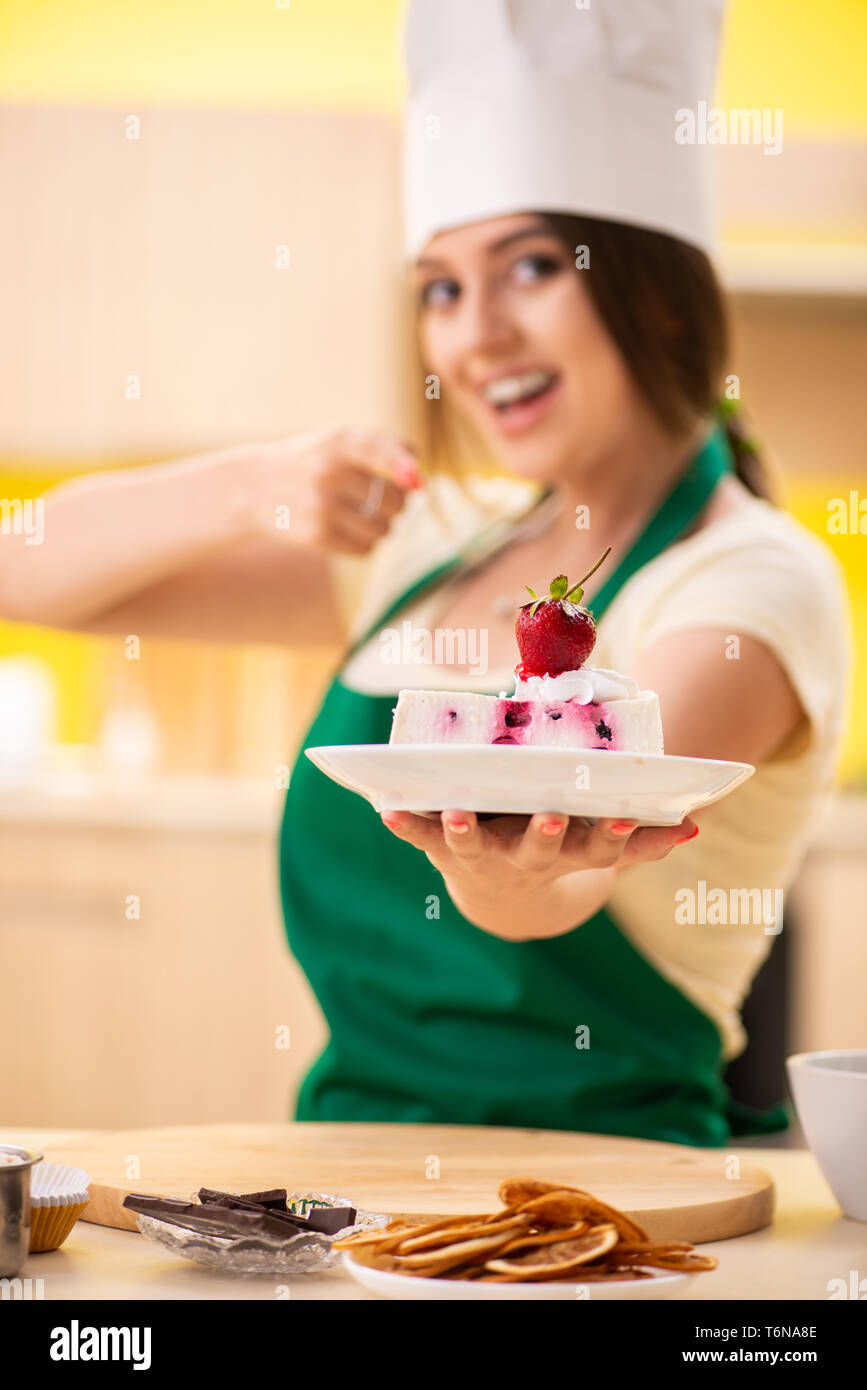 Young cook woman pointing hi-res stock photography and images - Alamy