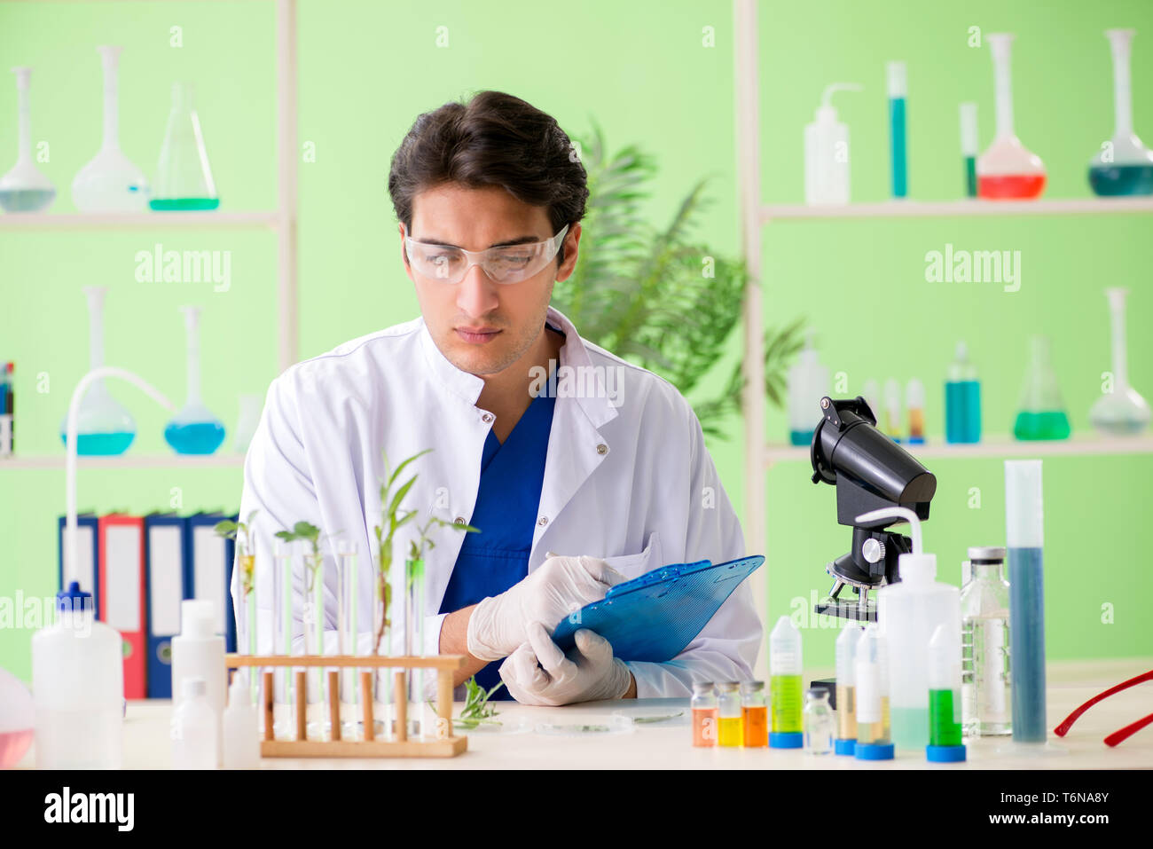 Young scientist writing results research hi-res stock photography and ...