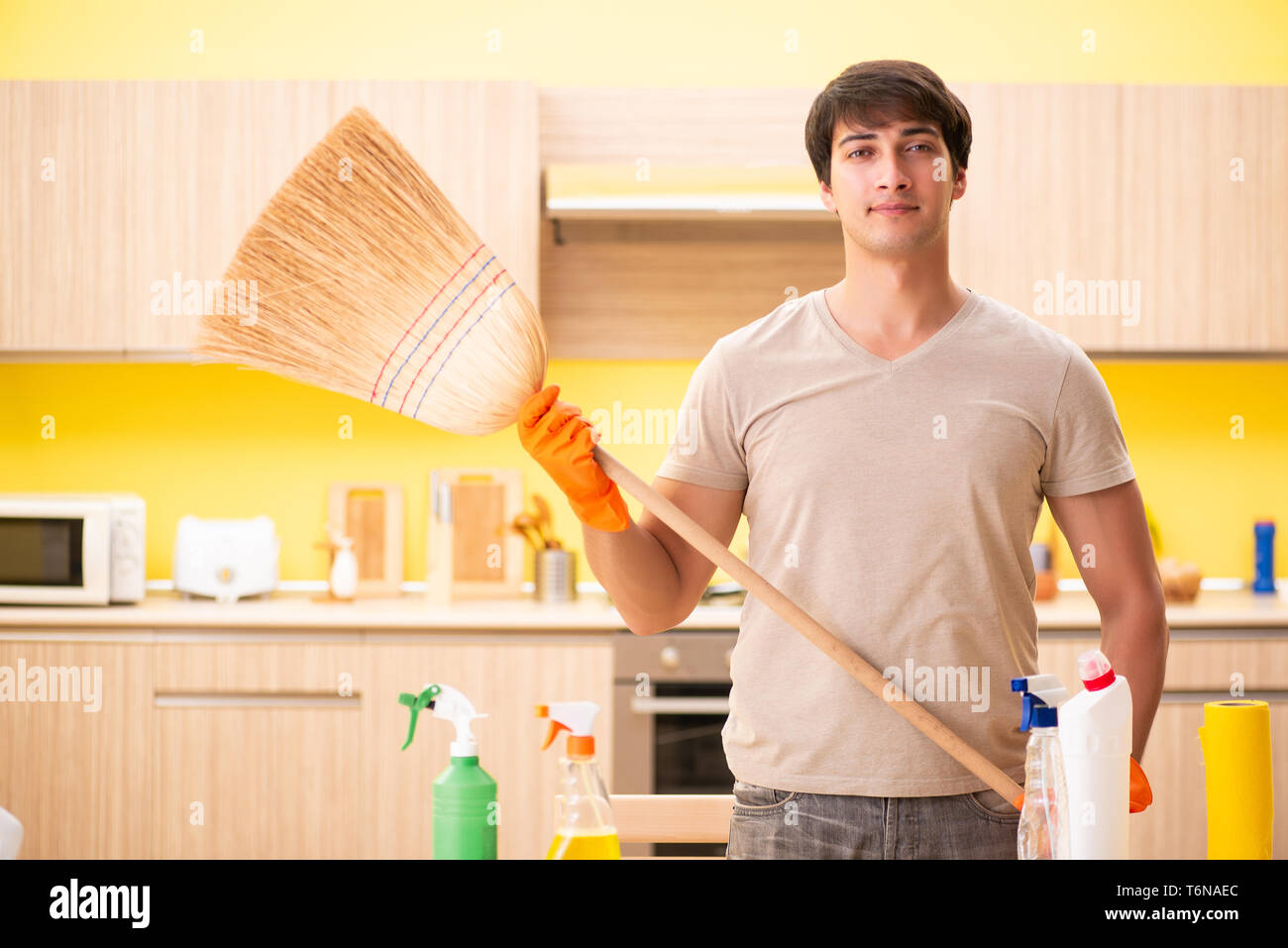 The single man cleaning kitchen at home Stock Photo - Alamy
