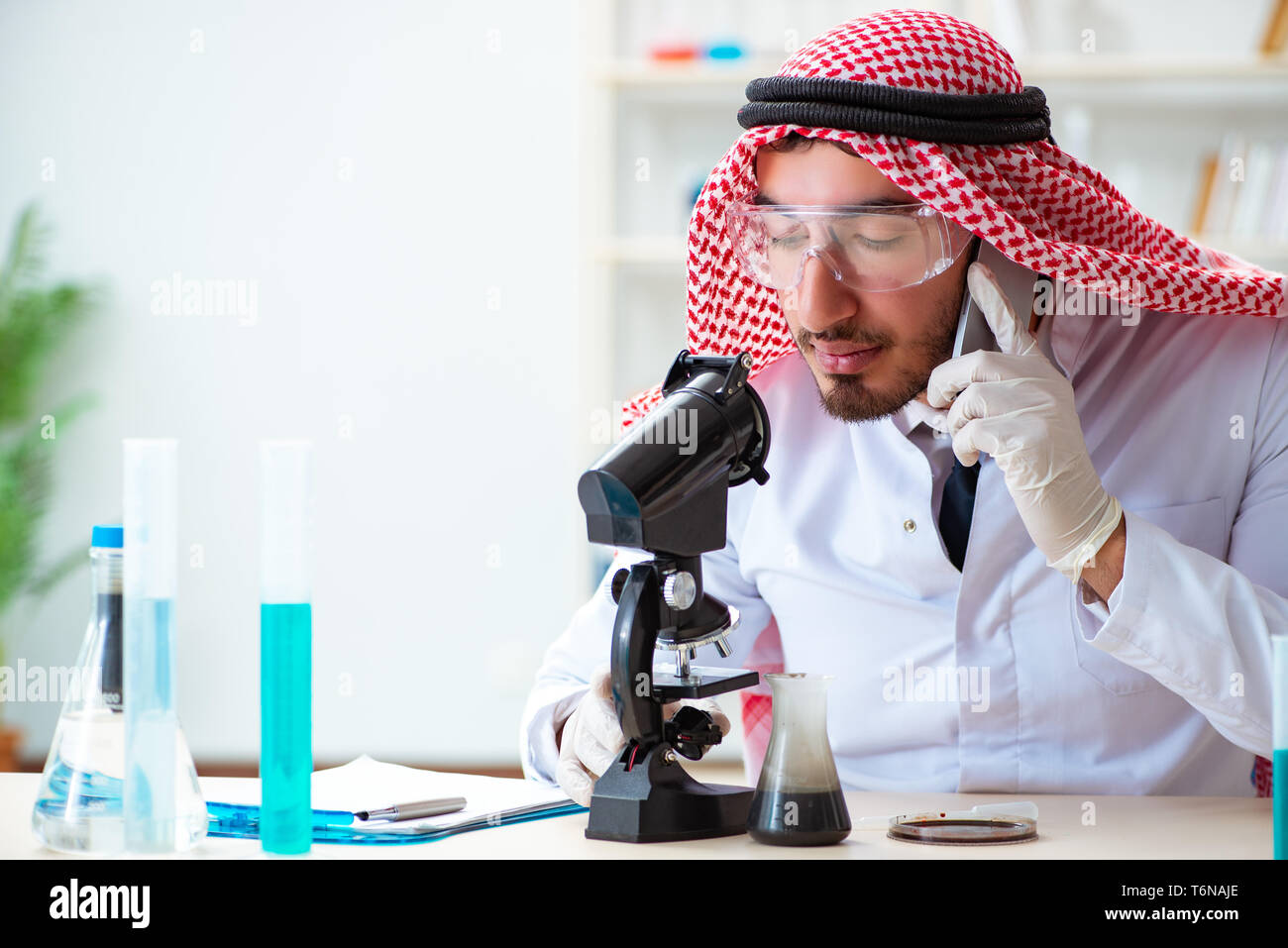 The arab chemist scientist testing quality of oil petrol Stock Photo ...