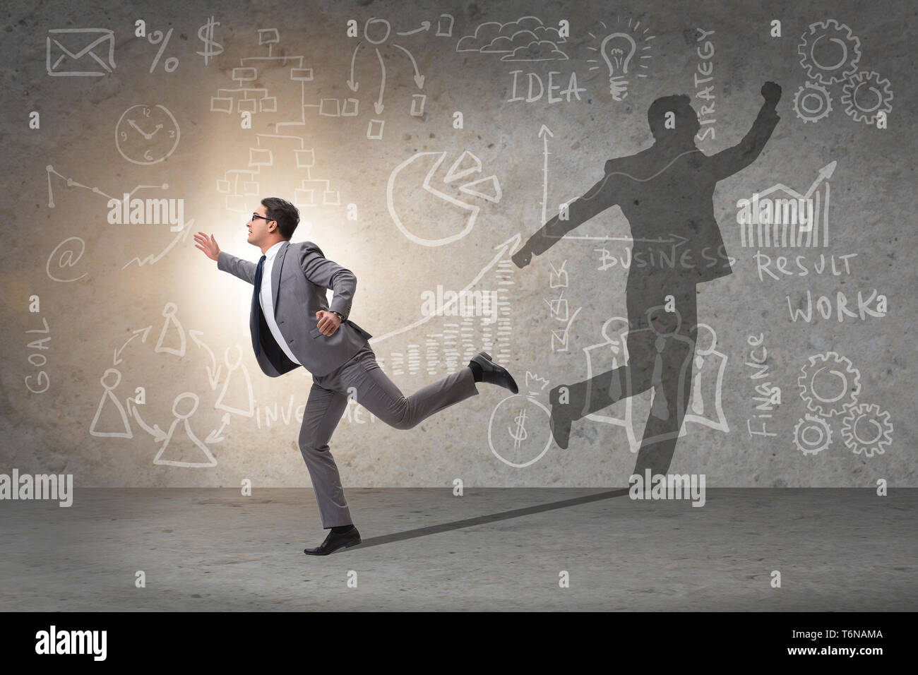 The businessman and his shadow in business concept Stock Photo - Alamy