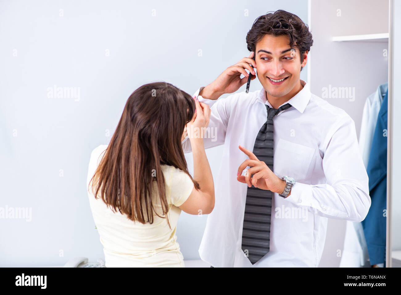 The woman sees her husband off to work Stock Photo - Alamy