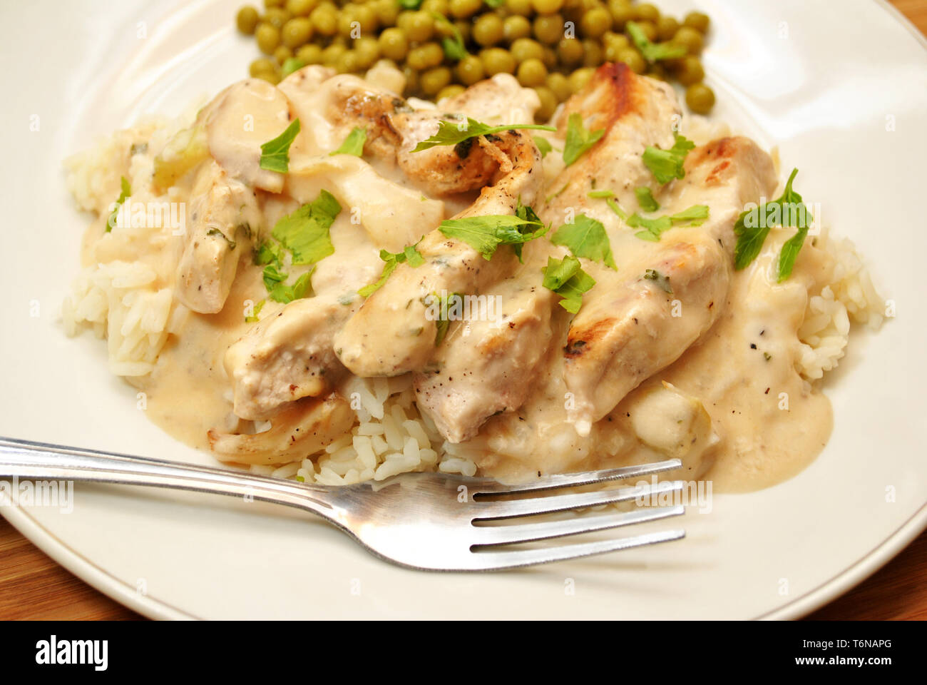 Pork with White Sauce Over White Rice Stock Photo - Alamy
