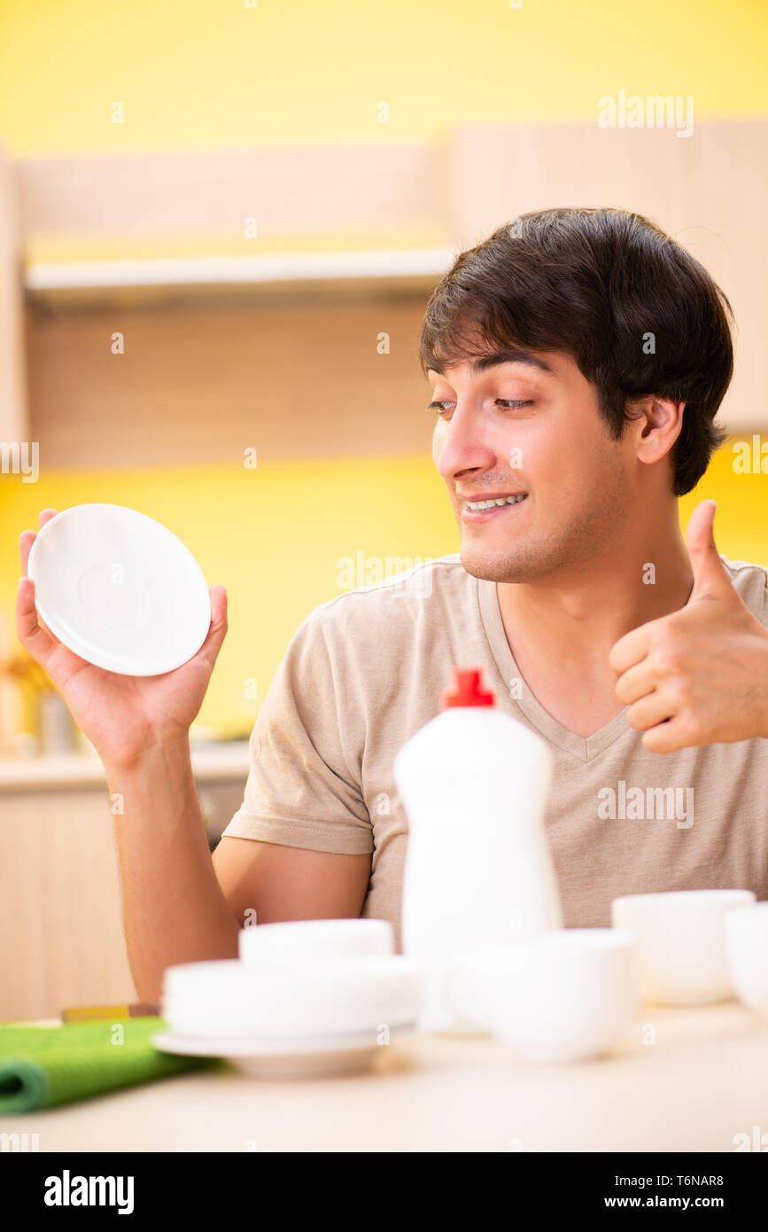 The man washing dishes at home Stock Photo - Alamy
