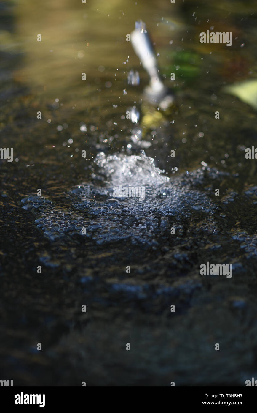 Water droplet dropping surface water hi-res stock photography and ...