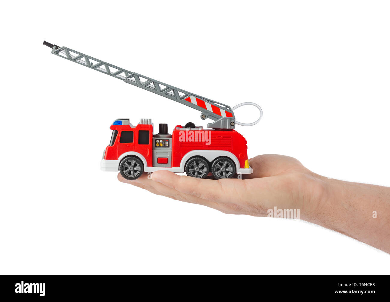 Hand with fire truck Stock Photo - Alamy