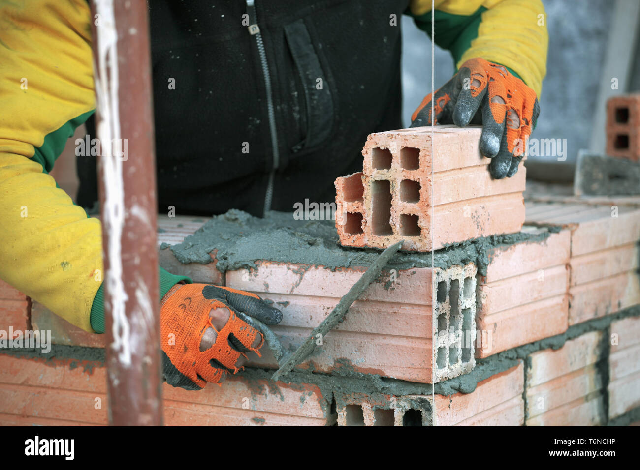 Men plastering brick wall hi-res stock photography and images - Alamy
