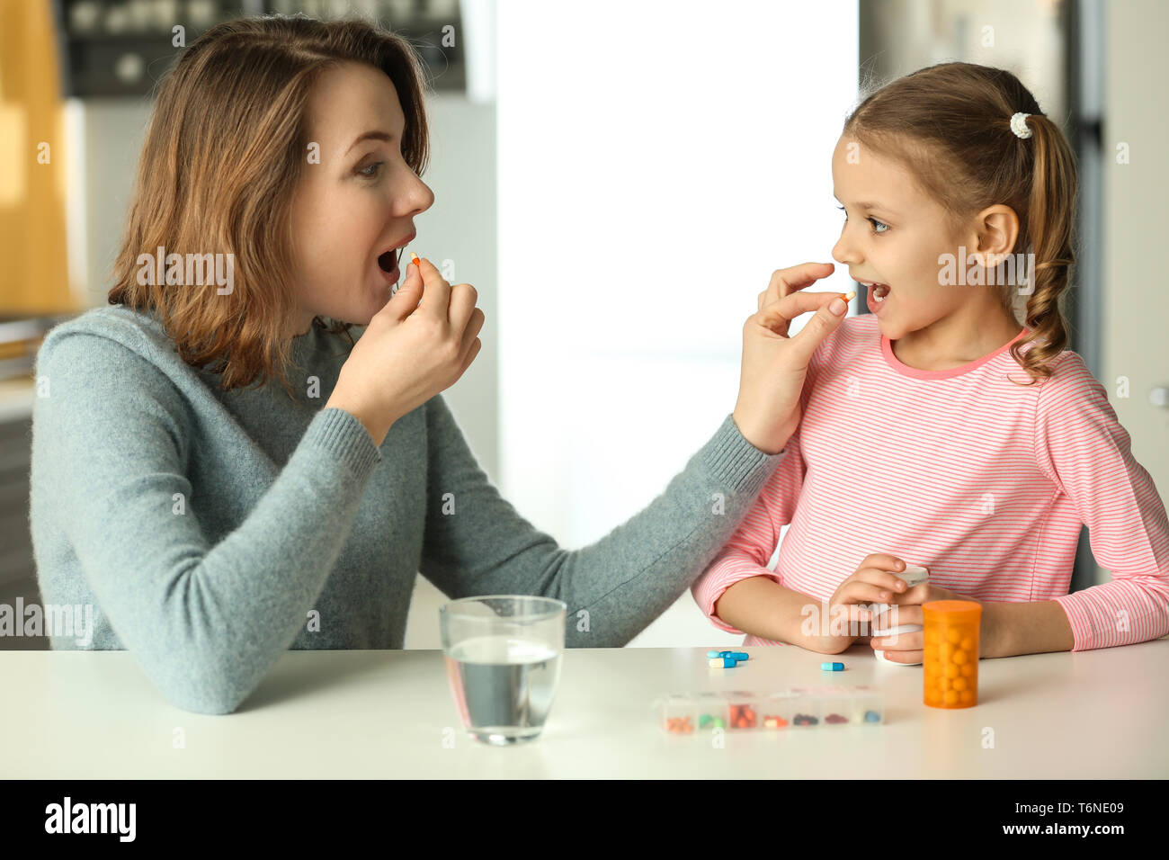 Child taking pills hi-res stock photography and images - Alamy