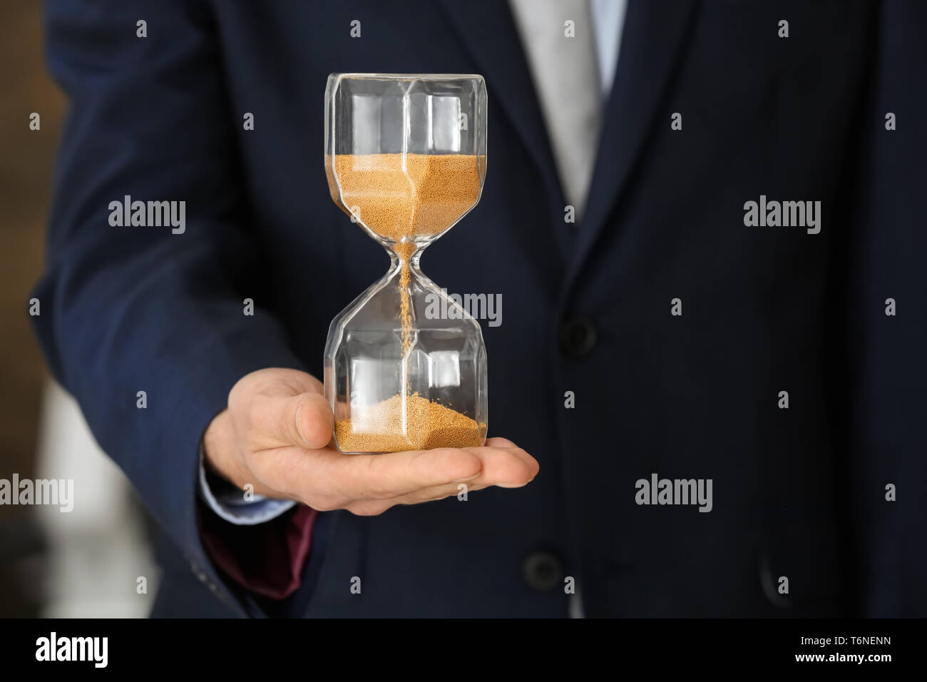 Man holding hourglass closeup hi-res stock photography and images - Alamy
