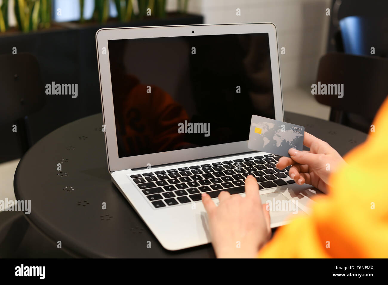 Woman with laptop ordering food delivery online at home Stock Photo - Alamy
