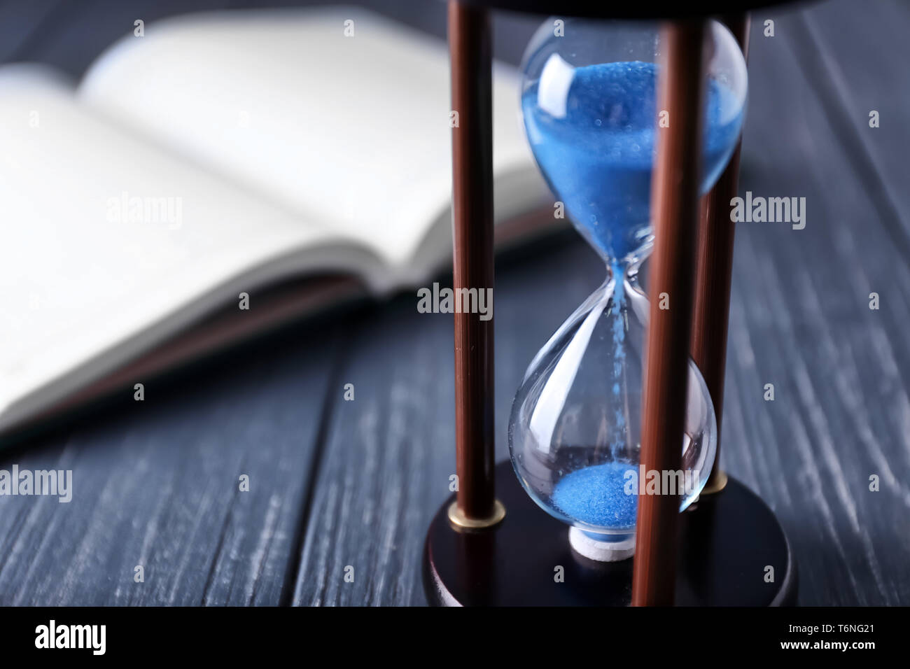 Stylish hourglass on table. Time management concept Stock Photo - Alamy