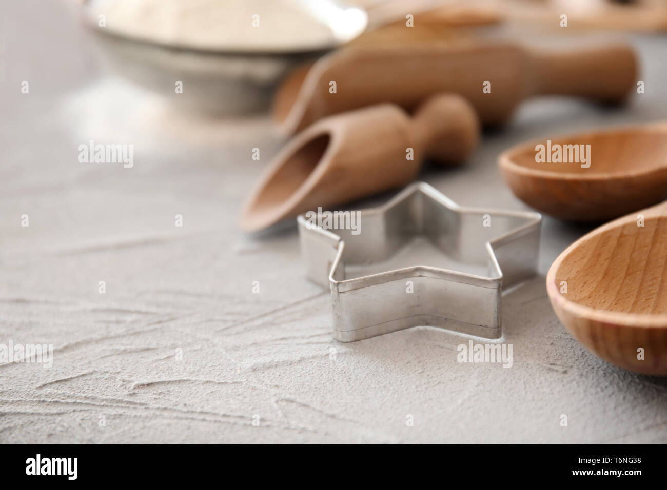 Dough cutter on kitchen table. Bakery workshop Stock Photo - Alamy