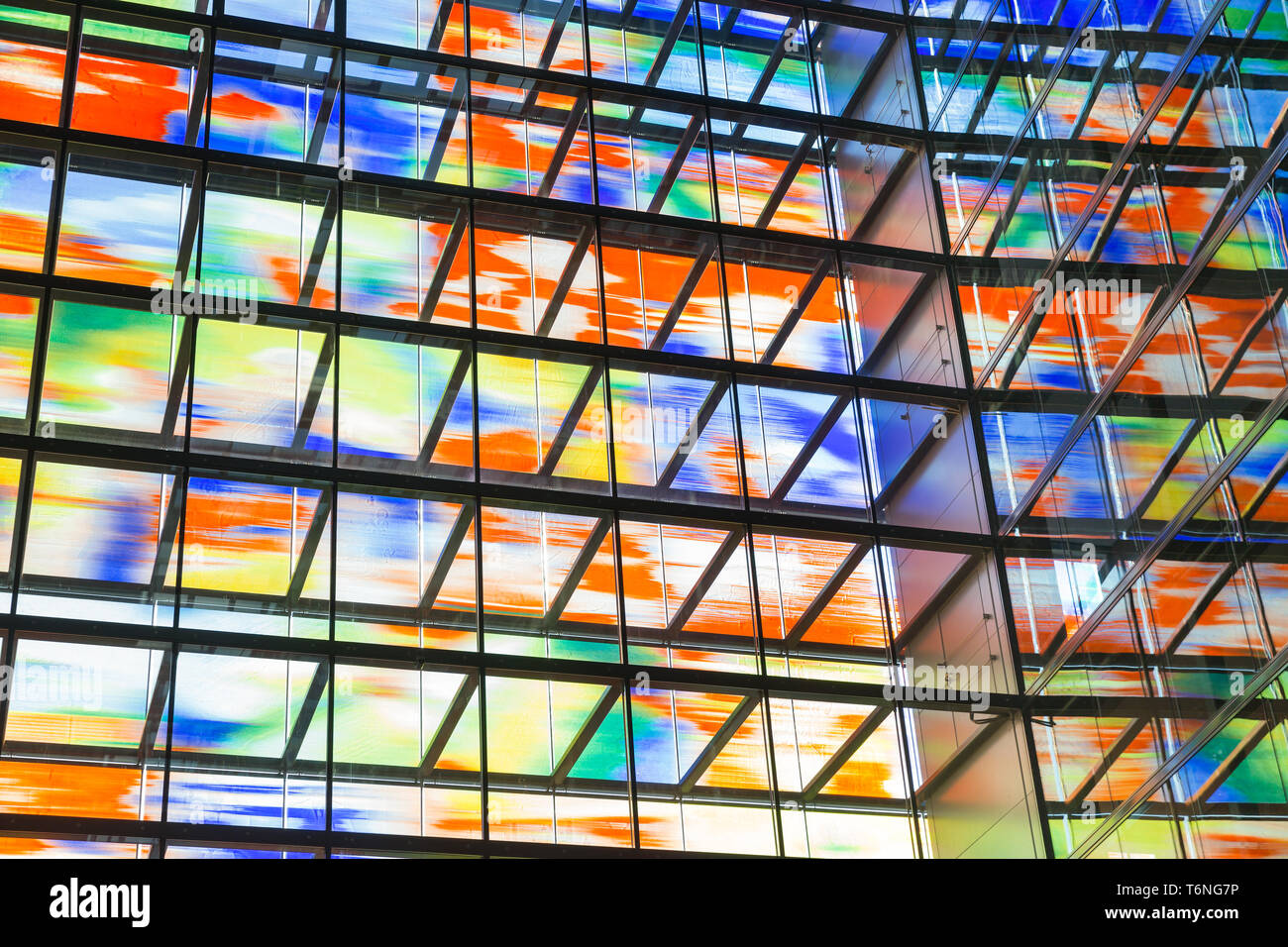 Interior modern building with colorful glass wall Stock Photo - Alamy
