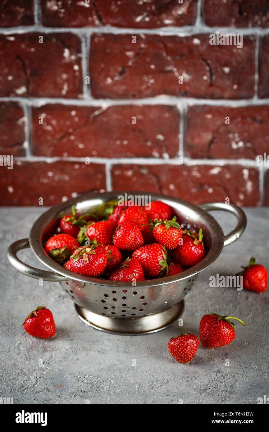 Ripe strawberry in colander Stock Photo - Alamy