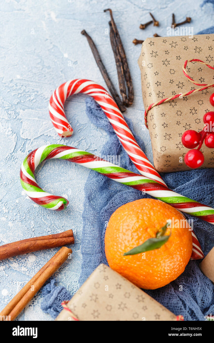 Christmas gift box, candy cane, tangerines Stock Photo - Alamy