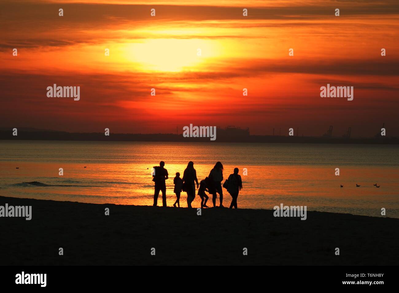 Beach walk at sunset Stock Photo - Alamy