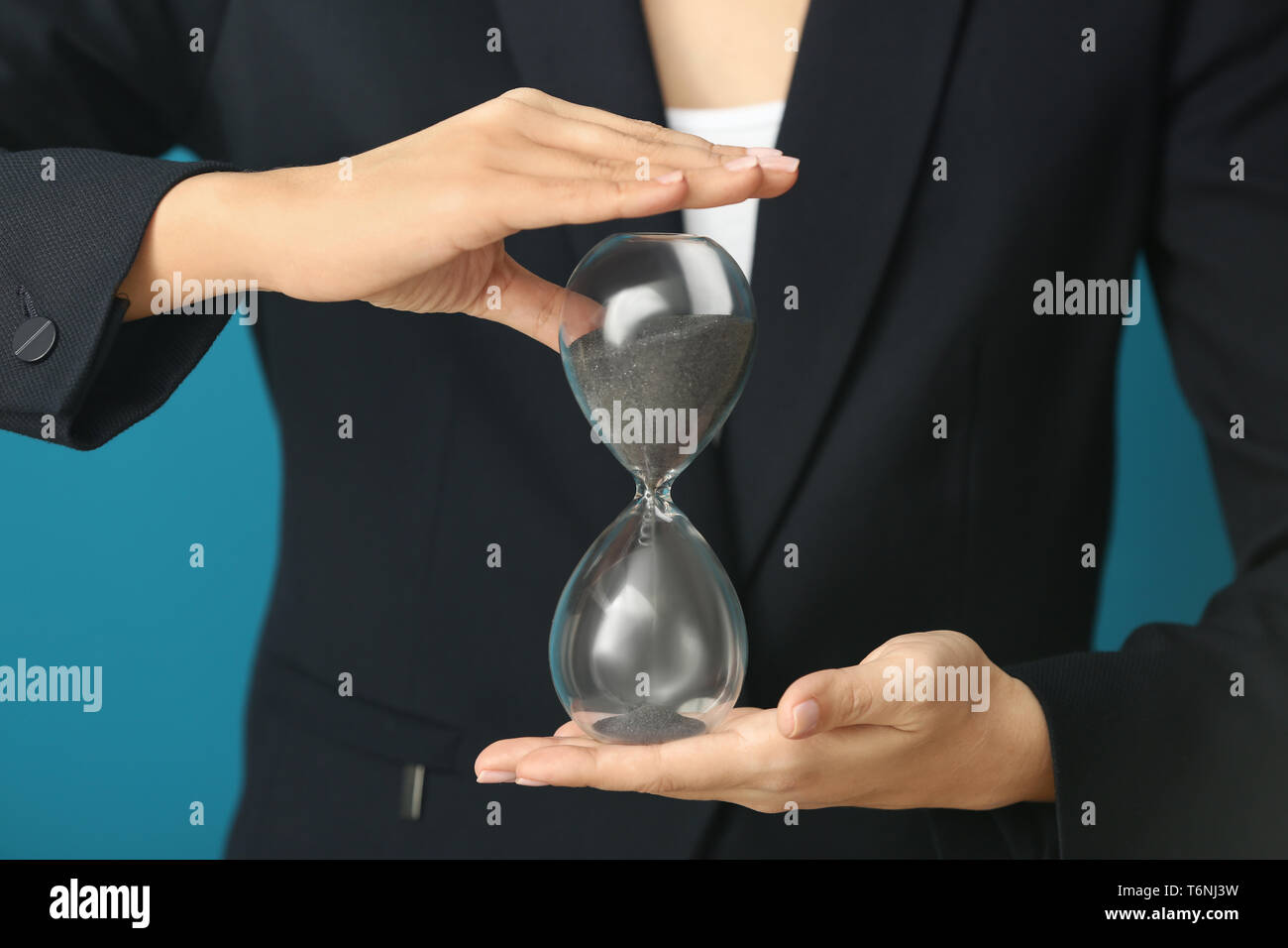 Woman holding hourglass, closeup. Time management concept Stock Photo ...