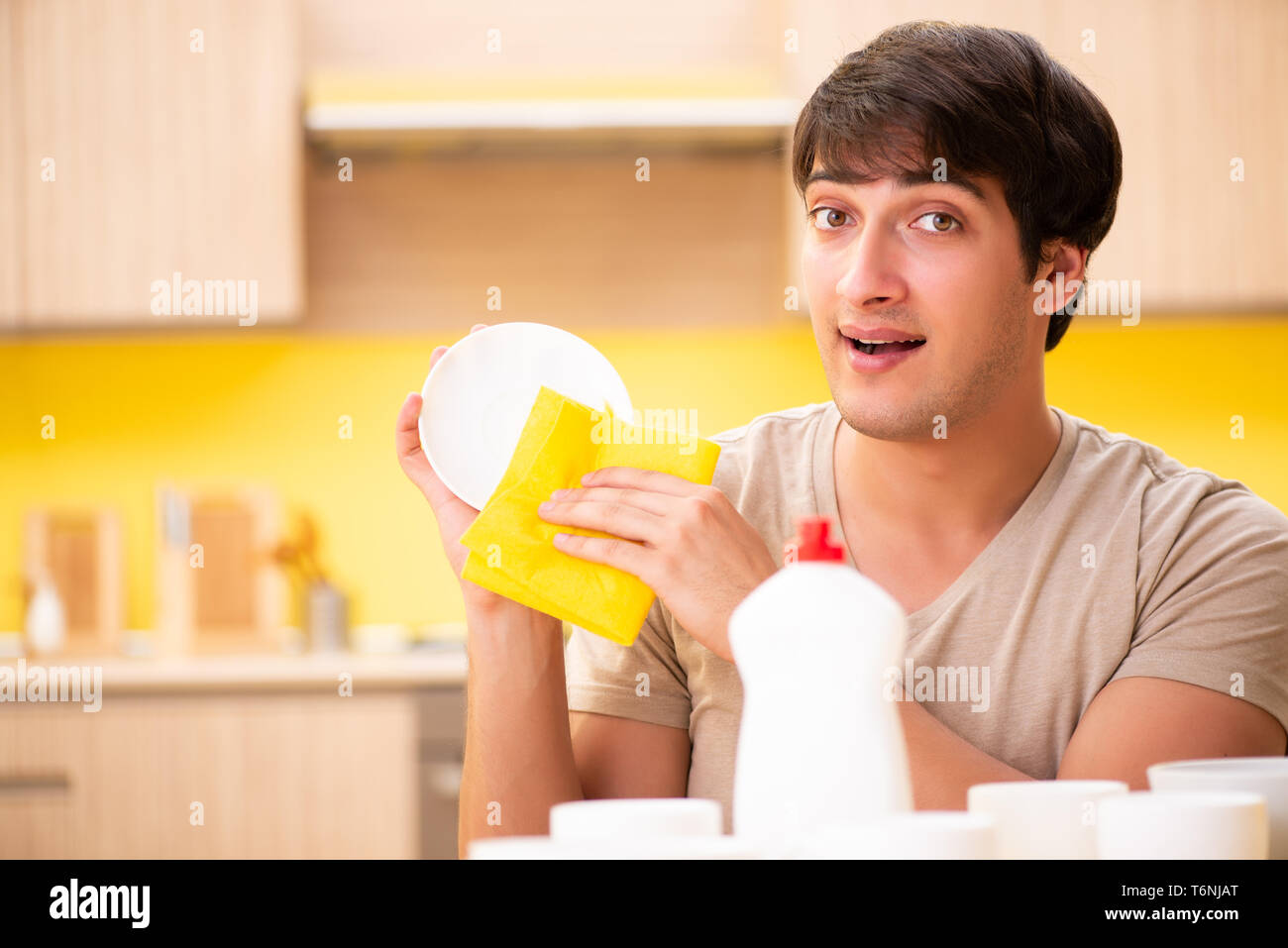 Man washing dishes at home Stock Photo - Alamy