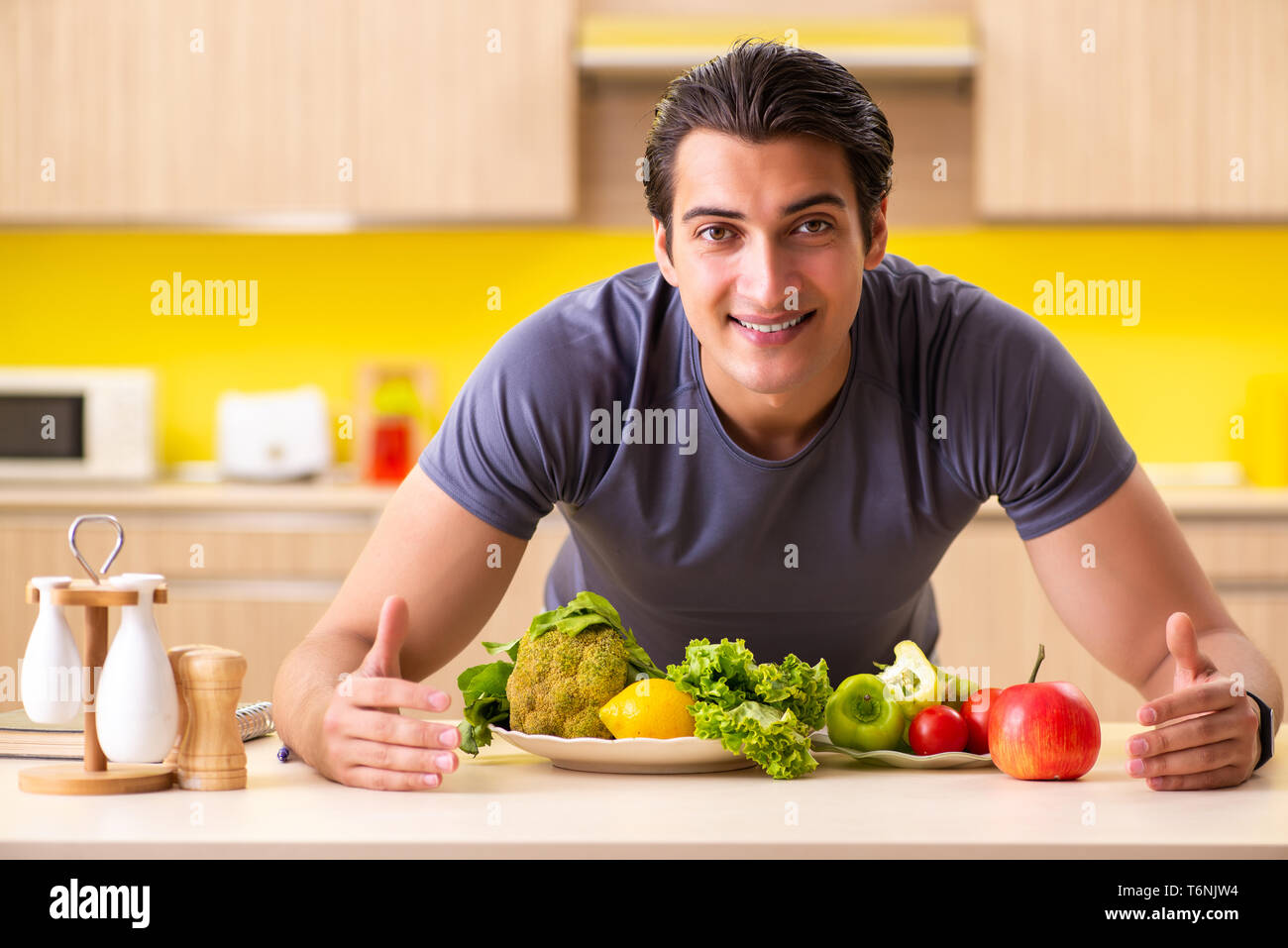 Young man in dieting and healthy eating concept Stock Photo - Alamy