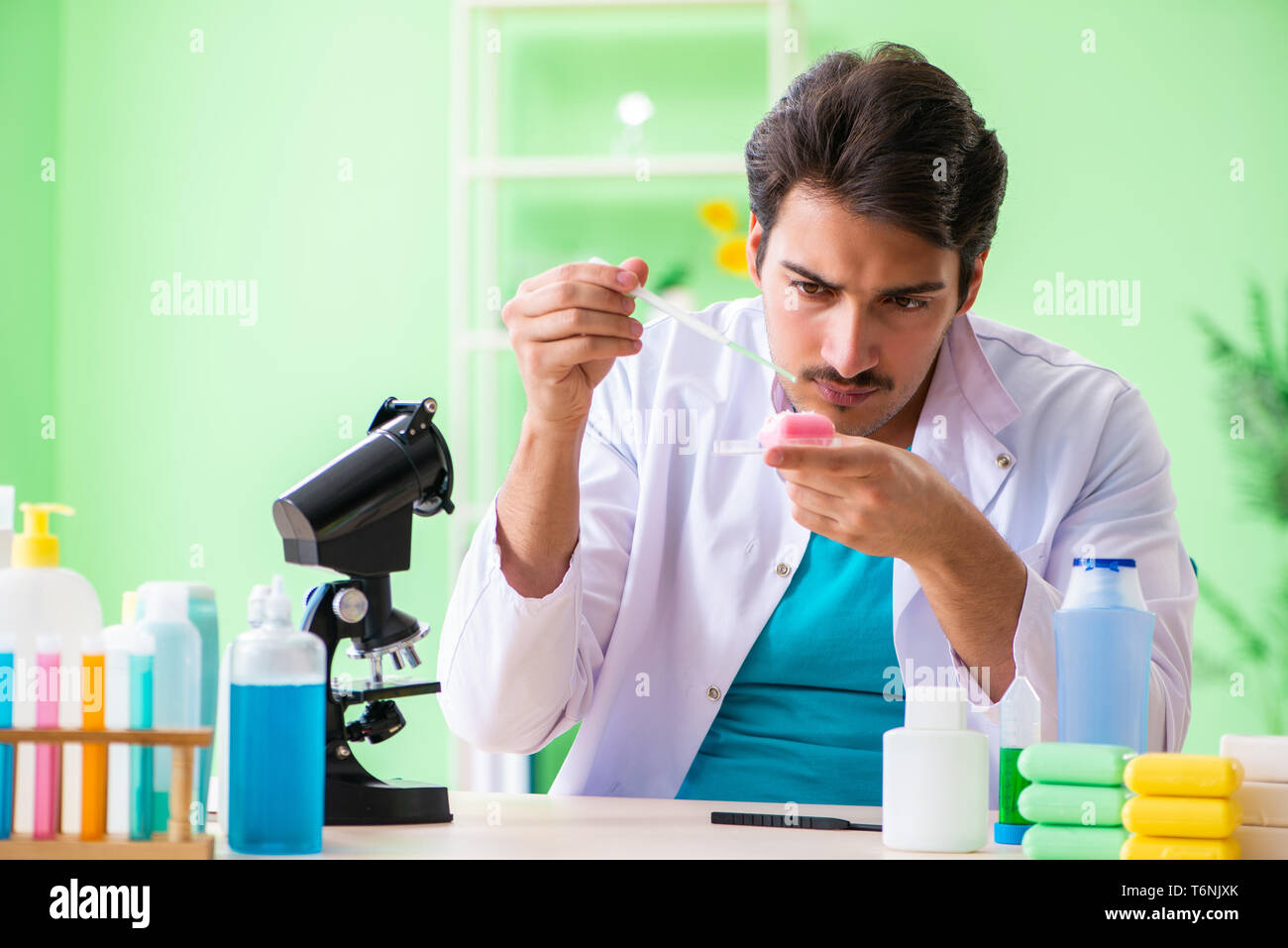 Chemist testing soap in hi-res stock photography and images - Alamy