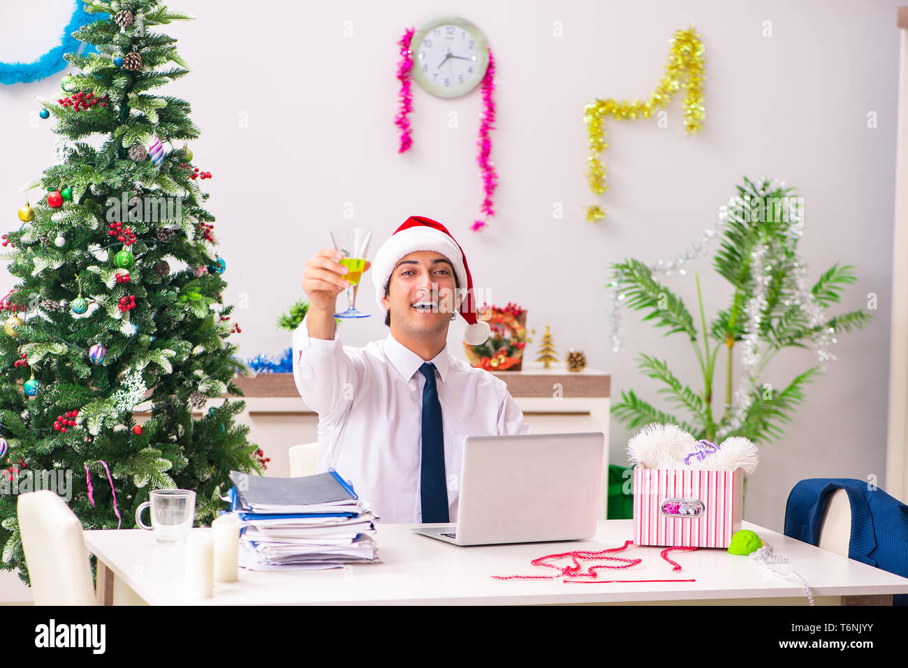 Employee businessman celebrating christmas in office Stock Photo - Alamy