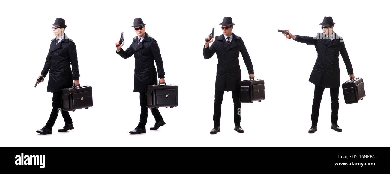 Man spy with handgun isolated on white background Stock Photo - Alamy