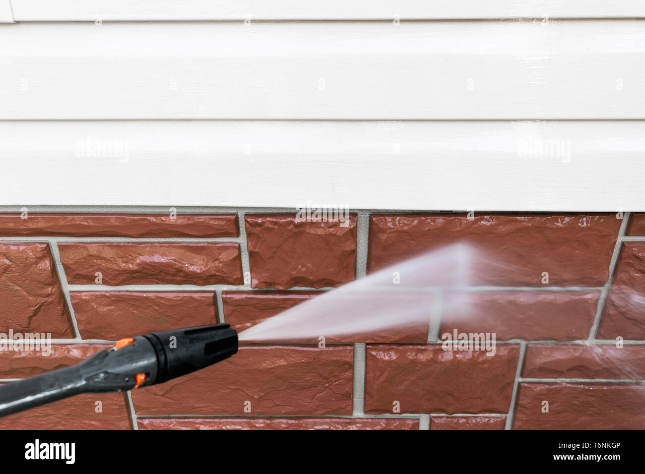 Cleaning service washing building facade with pressure water. Cleaning ...