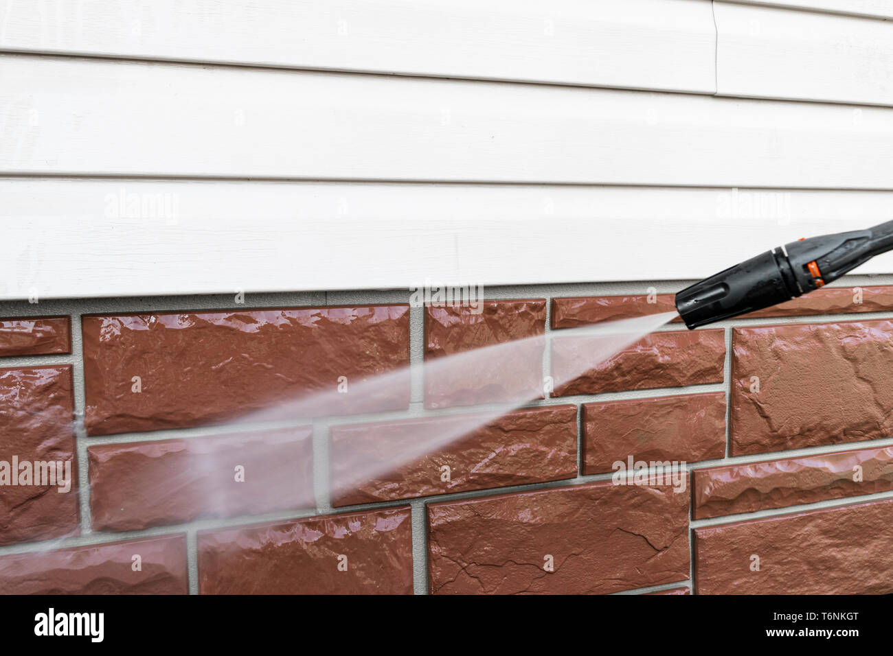 Cleaning service washing building facade with pressure water. Cleaning ...