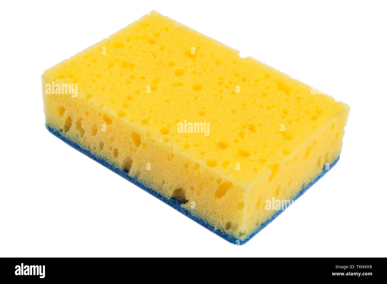 Macro shot of a surface of plastic yellow sponge isolated on white ...