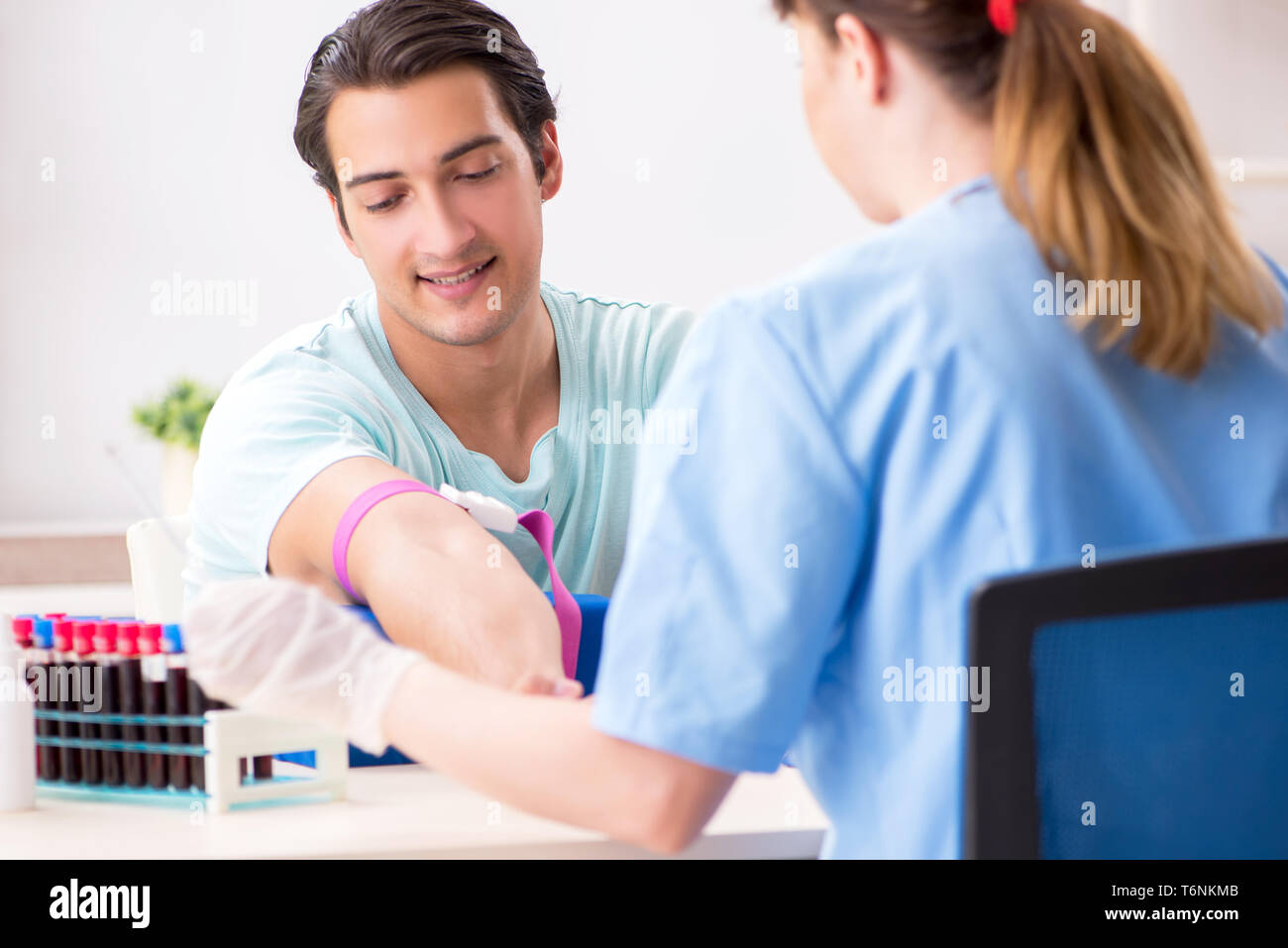 Young patient during blood test sampling procedure Stock Photo - Alamy