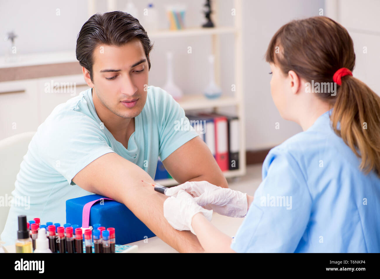 Young patient during blood test sampling procedure Stock Photo - Alamy