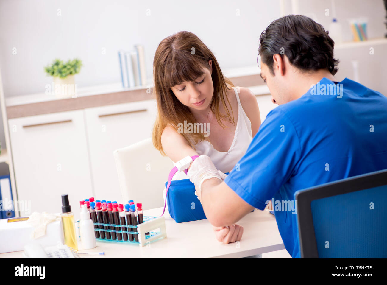 Young patient during blood test sampling procedure Stock Photo - Alamy