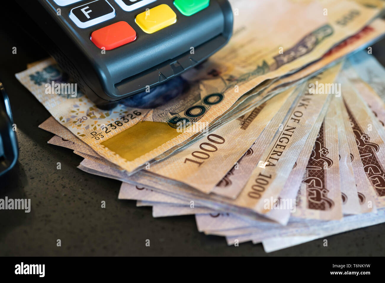 Point of Sale Machine with Nigerian Naira notes Stock Photo - Alamy