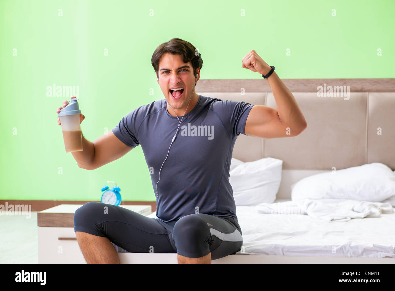 Young handsome man doing morning exercises in the hotel room Stock ...