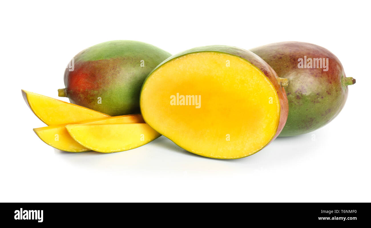 Whole and sliced mangoes on white background Stock Photo - Alamy