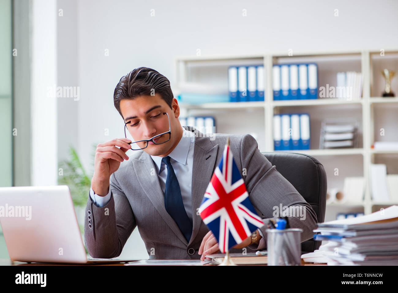 The businessman with british flag in the office Stock Photo - Alamy
