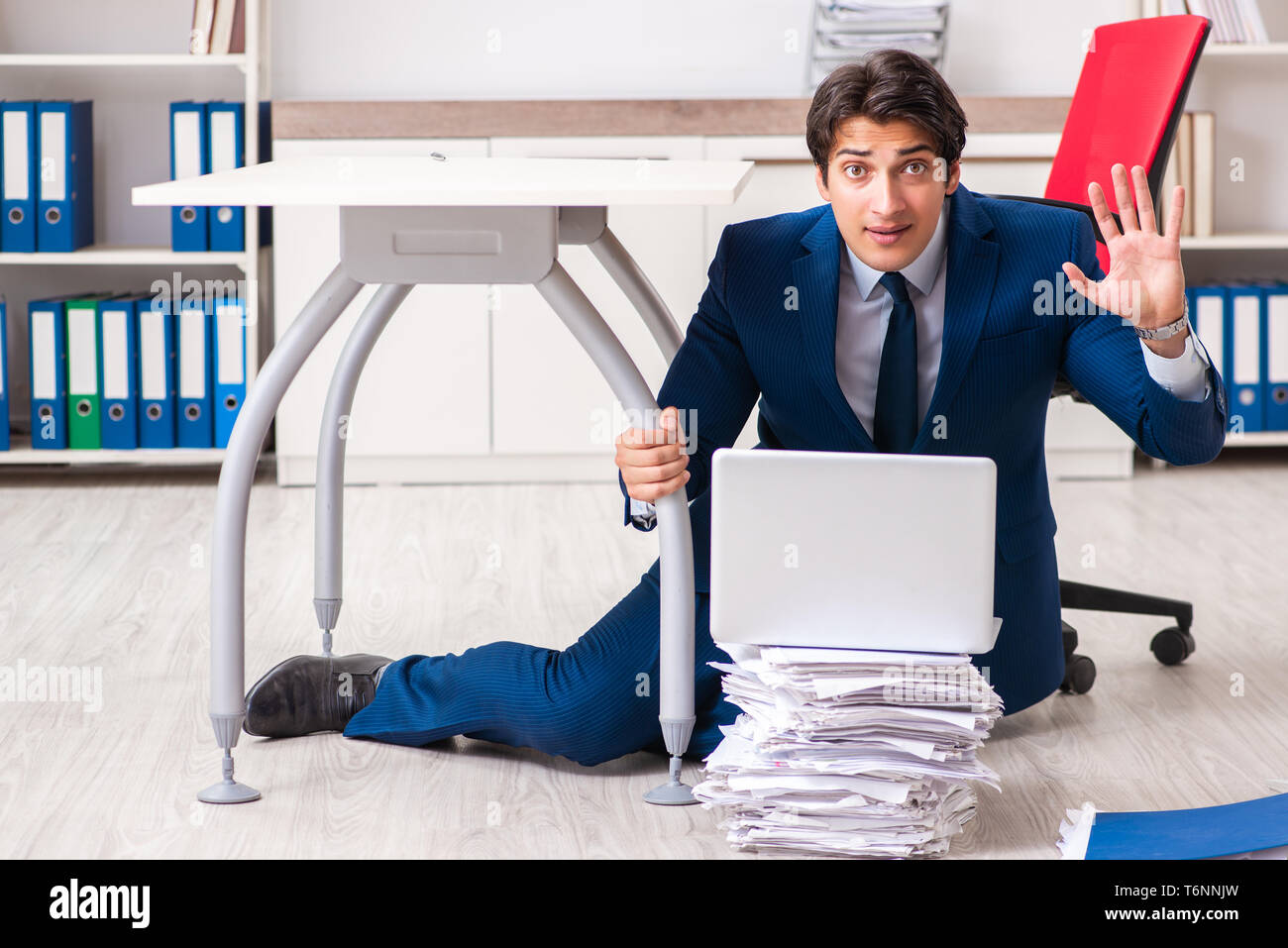 The tired exhausted businessman working overtime in office Stock Photo ...