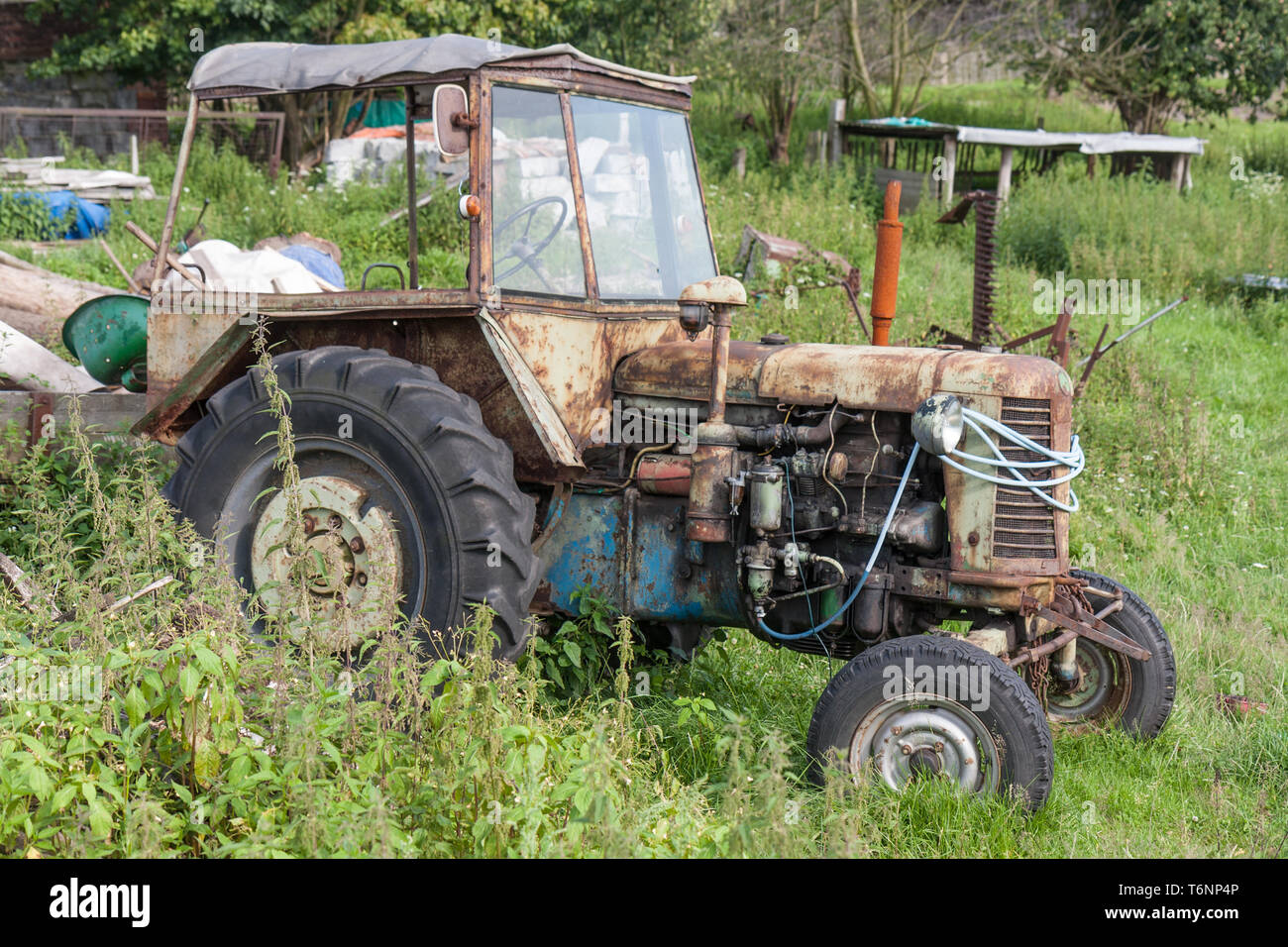 Old neglected tractor Stock Photo - Alamy