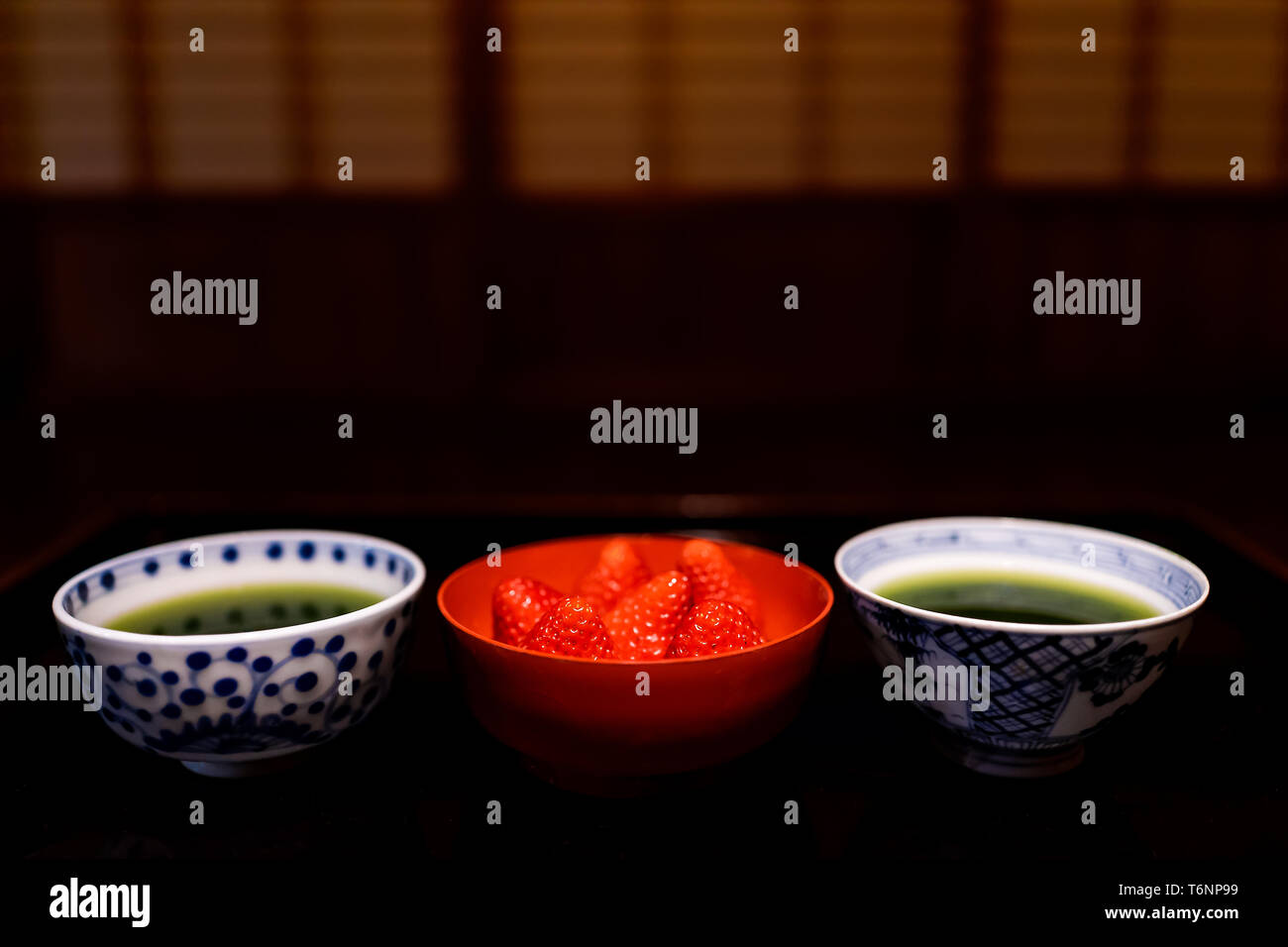 Traditional japanese bowls cups with matcha green tea and strawberries ...