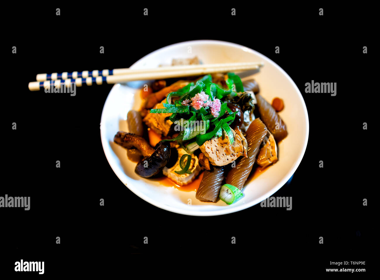 Traditional japanese plate in restaurant with black lacquered wood ...