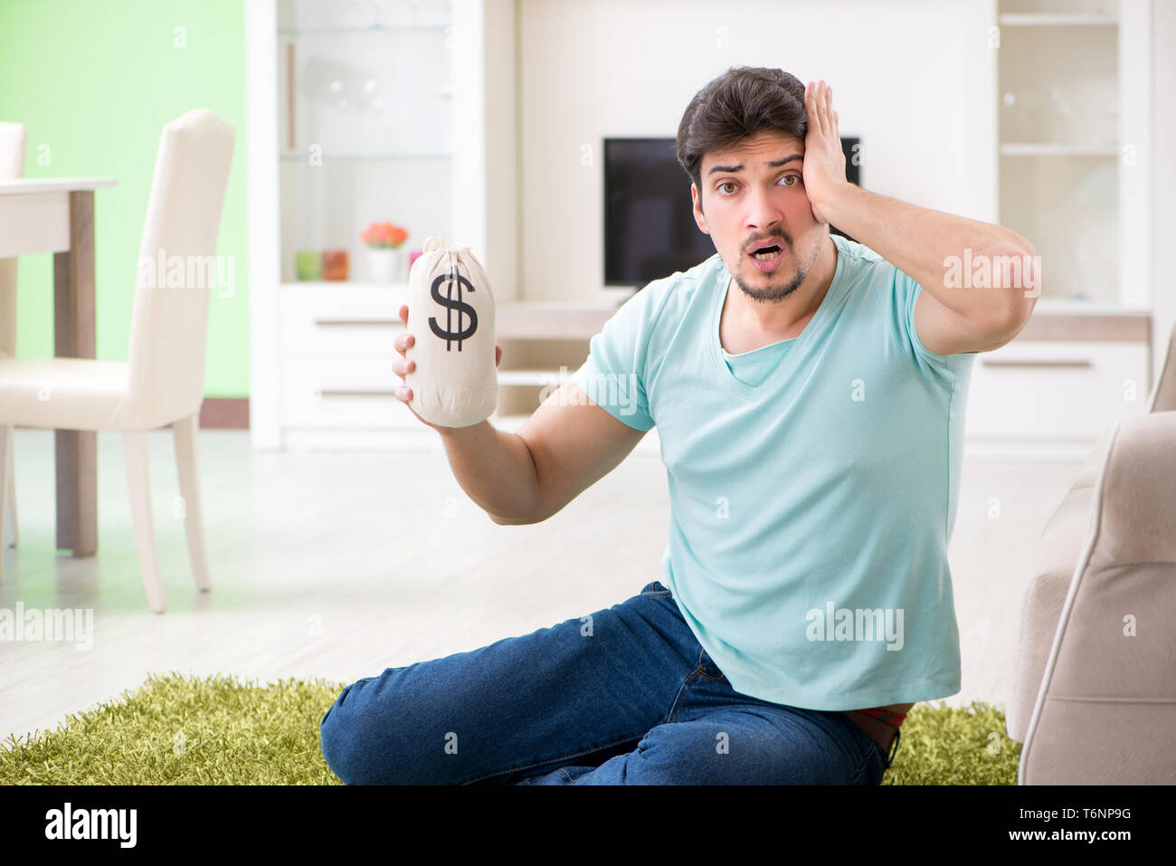 The young man struggling with personal finance and bills Stock Photo ...