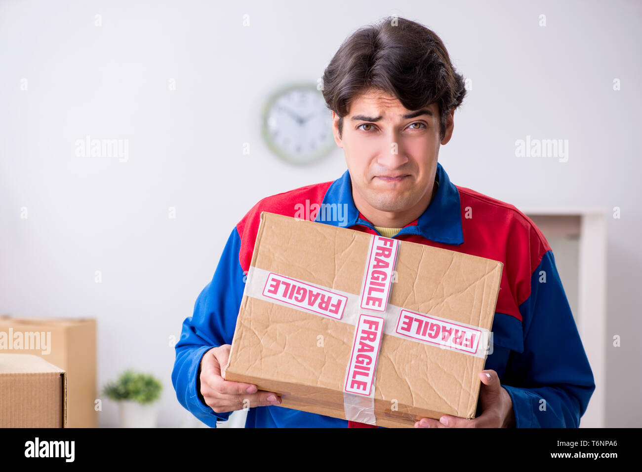 The transportation contractor with fragile boxes Stock Photo - Alamy