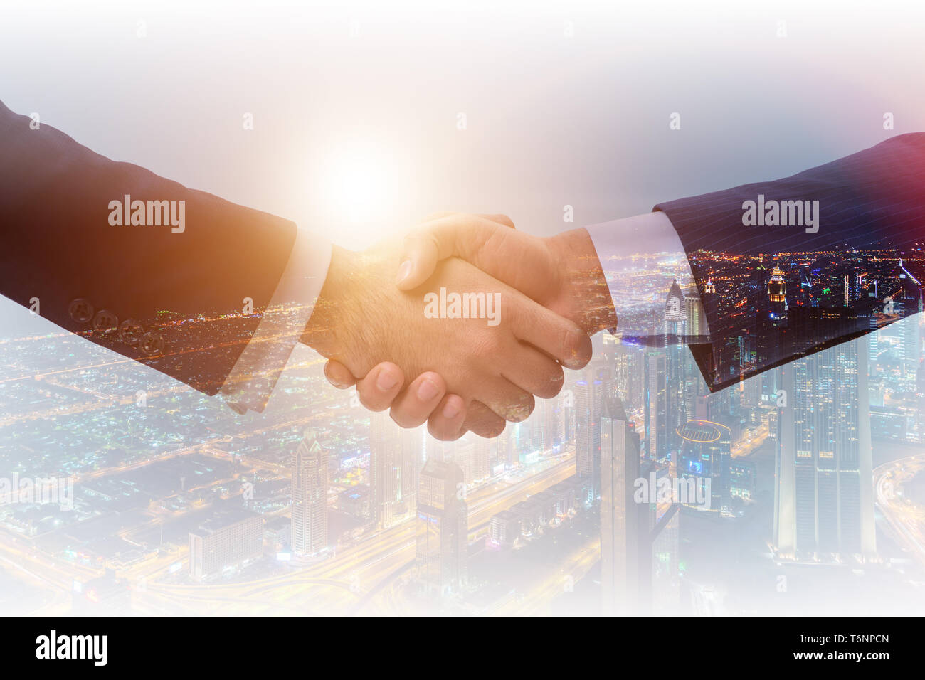 The concept of cooperation with handshake Stock Photo - Alamy