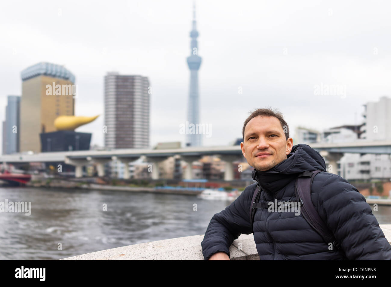 Tokyo, Japan Sumida district area cityscape skyline with young tourist ...