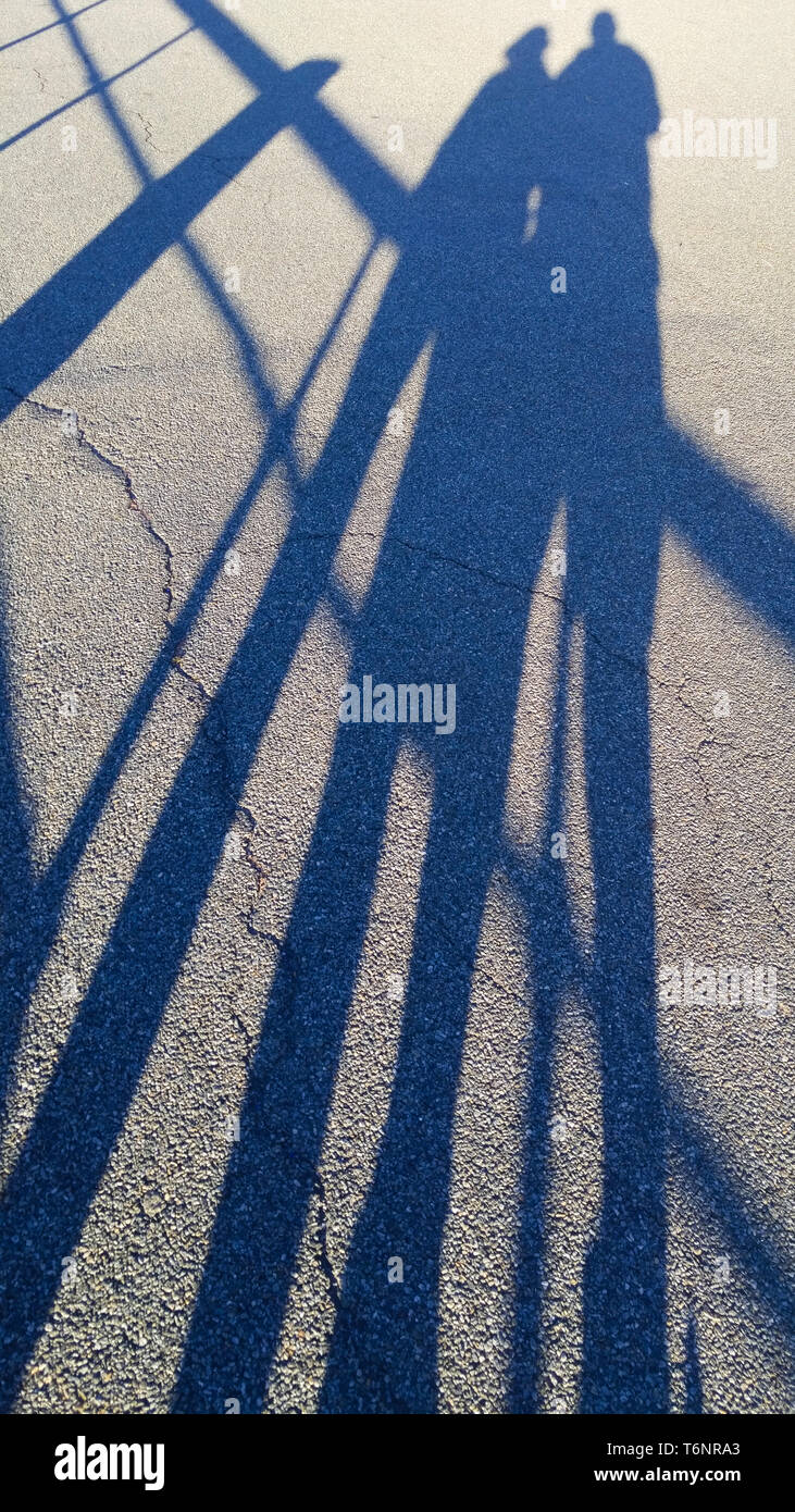 Two human shadows on street hi-res stock photography and images - Alamy