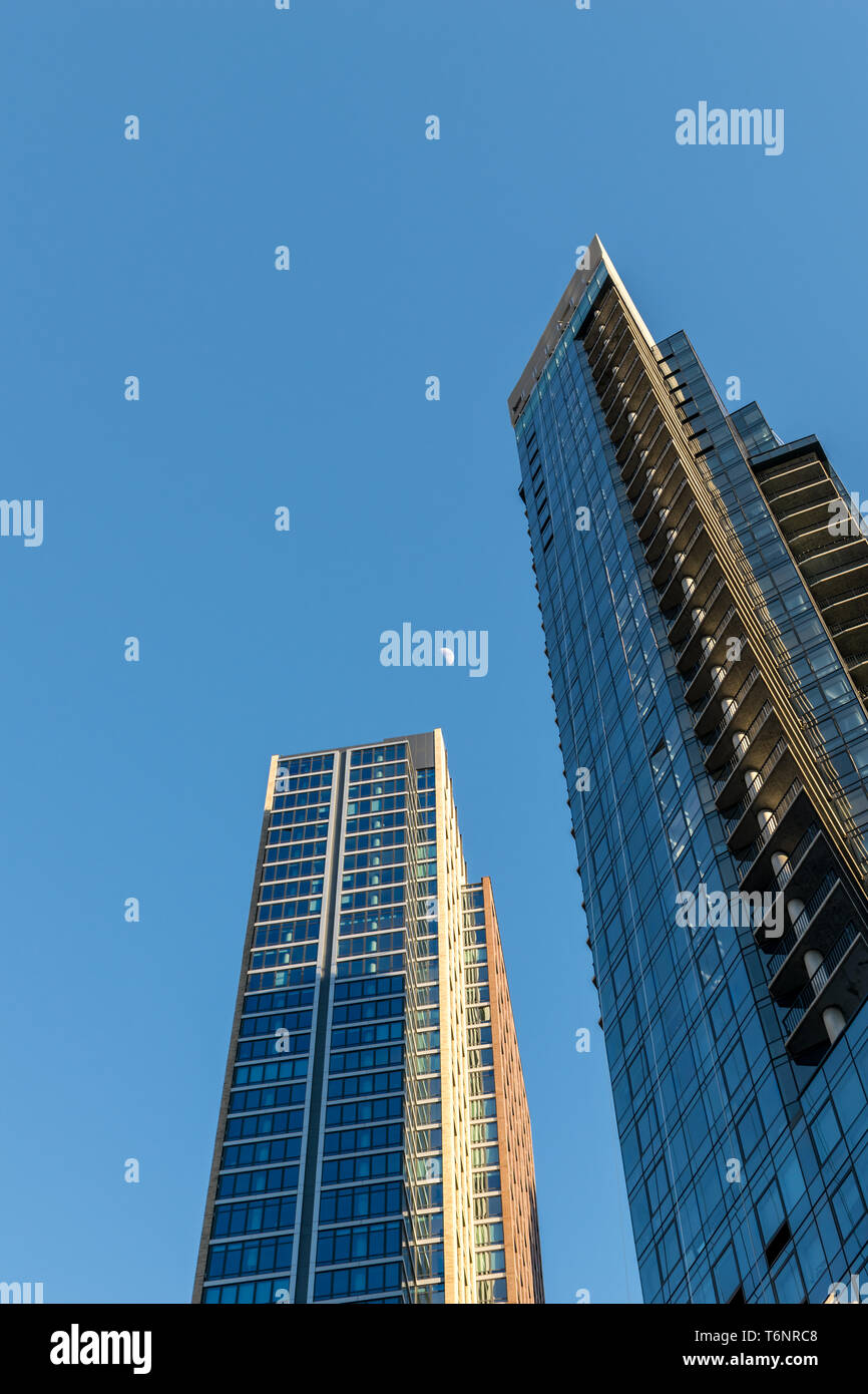 Tall skyscrapers in downtown Brooklyn point toward the distant moon and ...