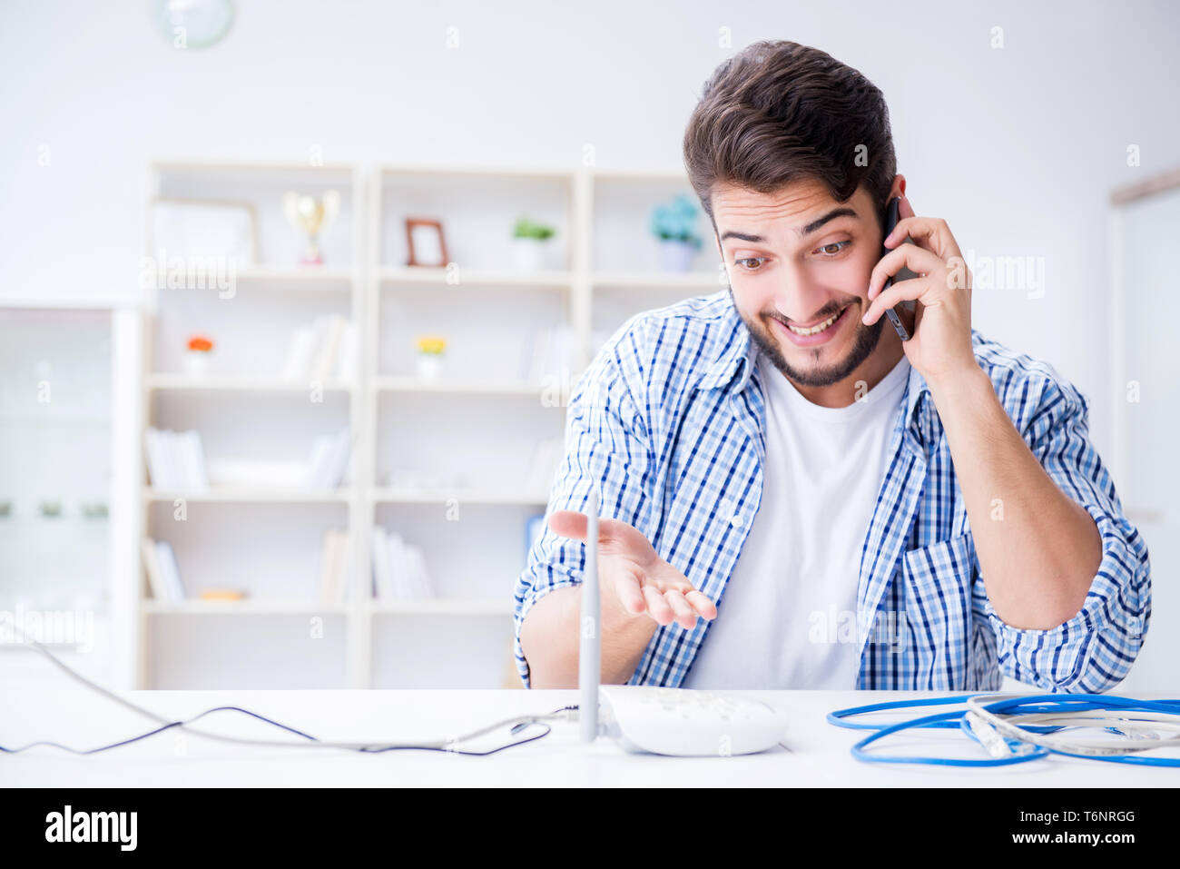 Man enjoying fast internet connection Stock Photo - Alamy
