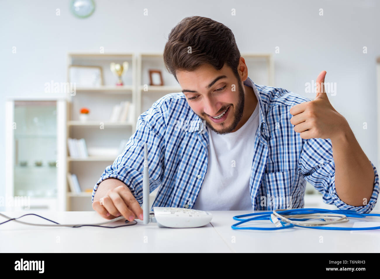Man enjoying fast internet connection Stock Photo - Alamy