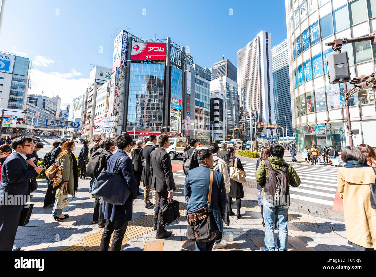 Tokyo, Japan - April 1, 2019: Shinjuku street sidewalk with traffic of ...